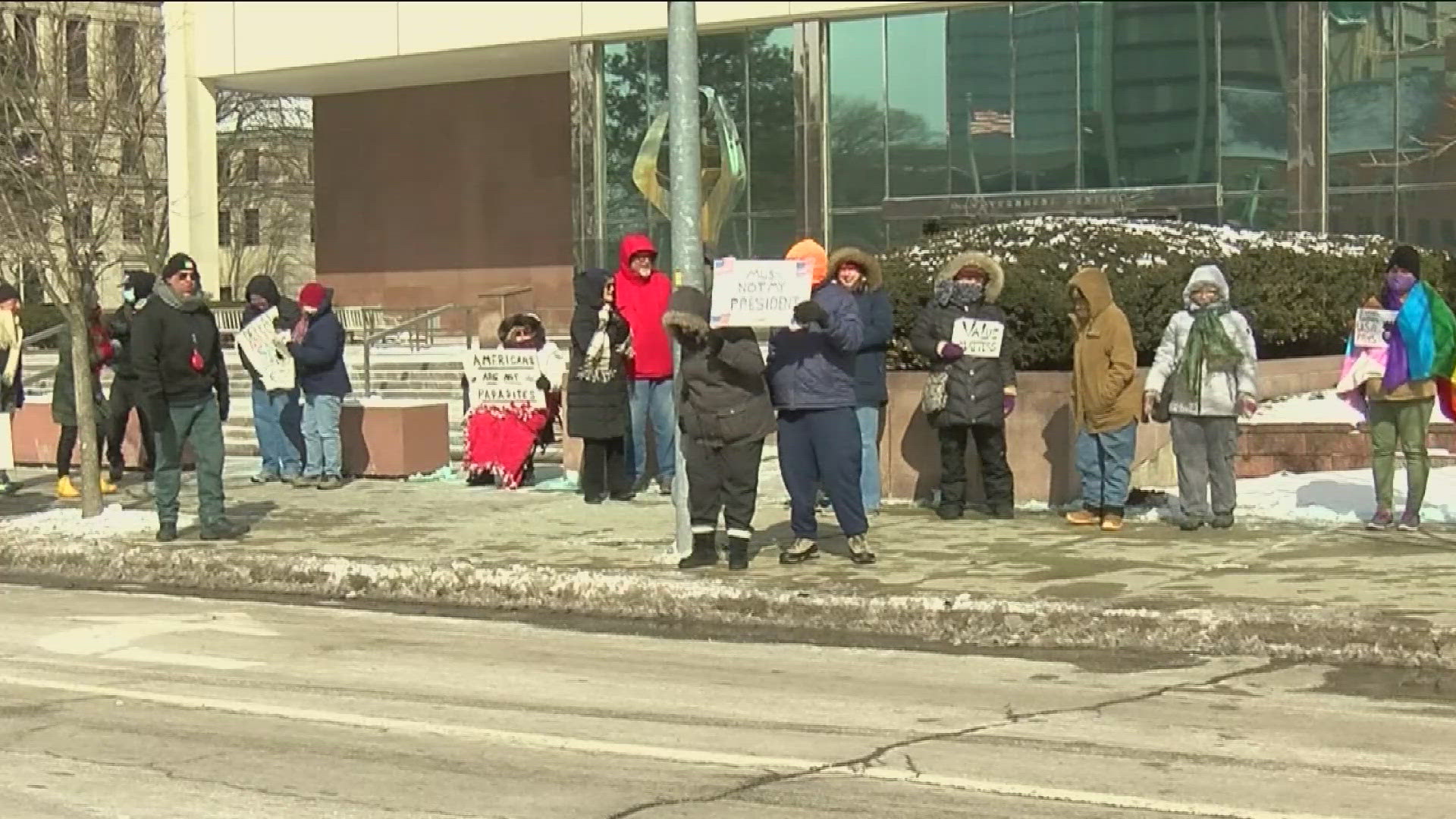 Protesters gather in downtown Toledo to oppose President Trump, Elon ...