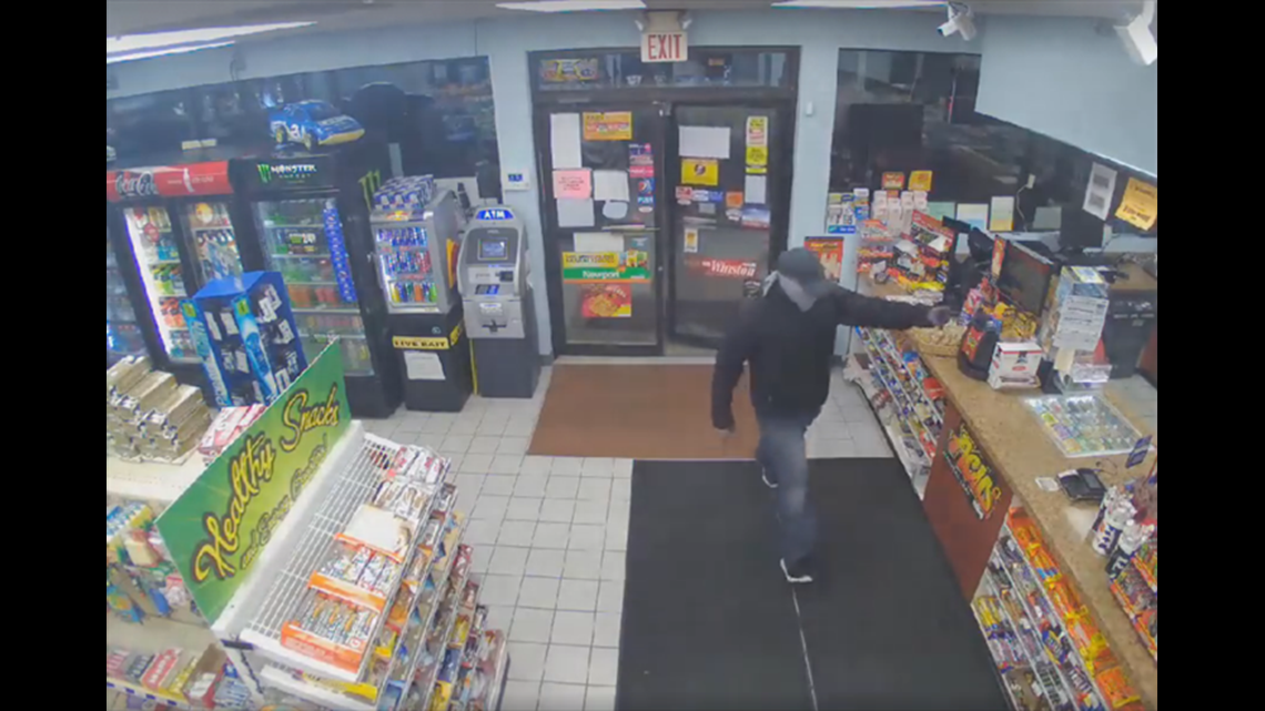Two angles of surveillance video show armed robbery in progress | wtol.com