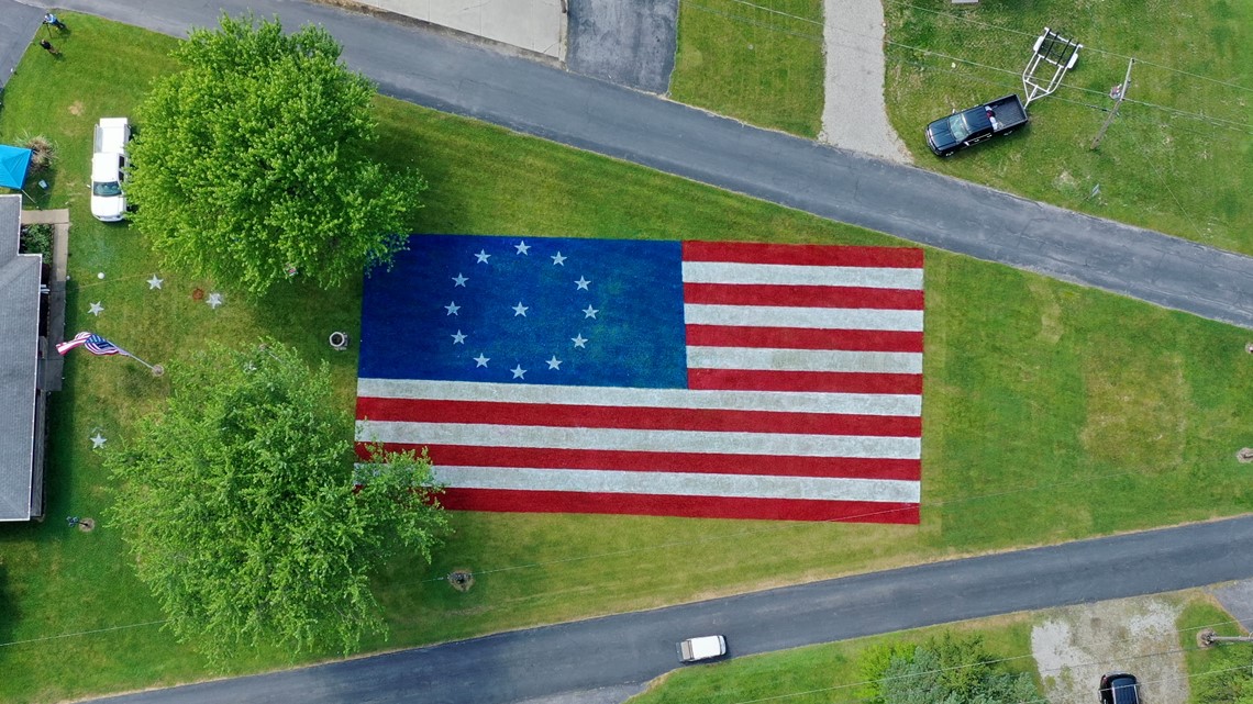 Port Clinton veteran paints large American flag on lawn | wtol.com