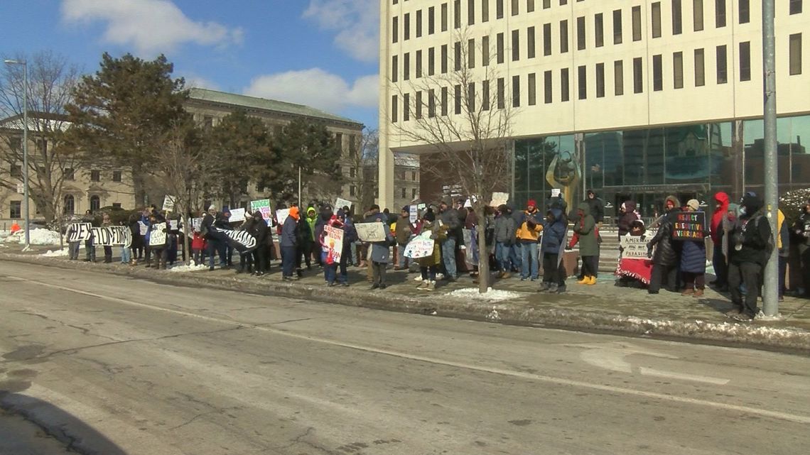 Protesters gather in downtown Toledo to oppose President Trump, Elon ...