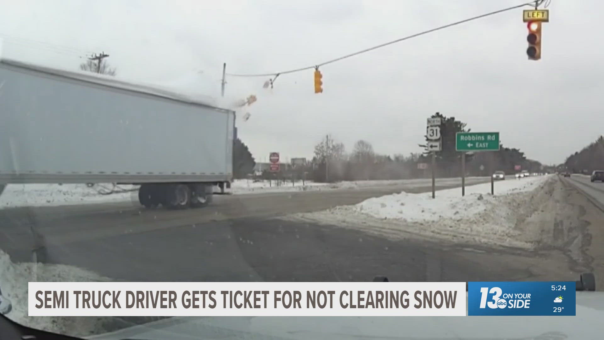 Driver cited after snow piled so high on top of semi that it hit ...